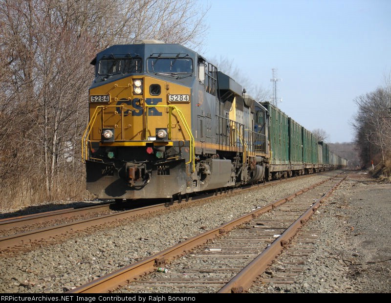 CSX Train K207, unit trash train, heads through town for the Trenton Line